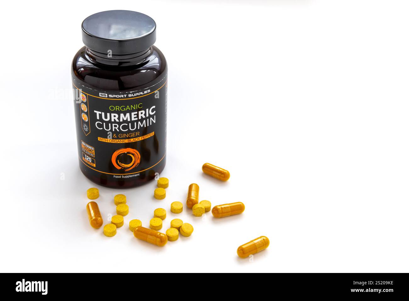 London. UK-01.01.2025. A bottle of organic turmeric curcumin with some ...