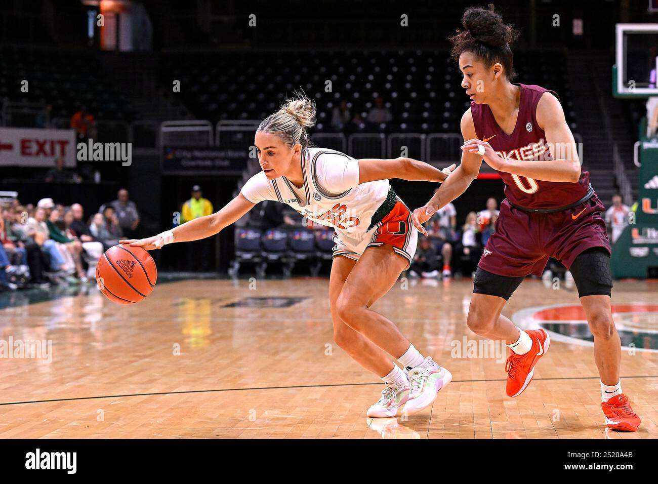 CORAL GABLES, FL - JANUARY 05: Miami guard Hanna Cavinder (15) beats ...