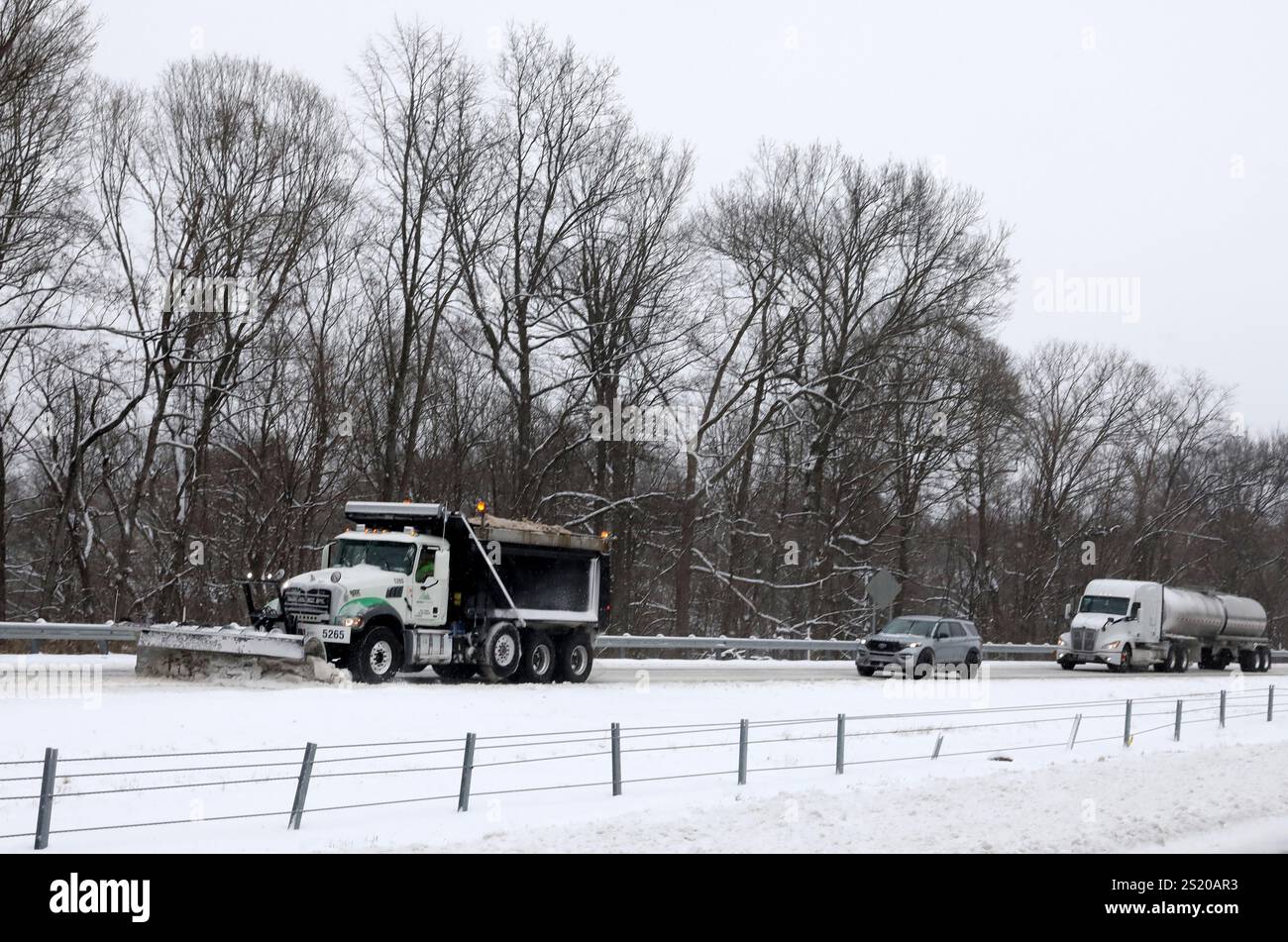 Kentucky road crews work to clear snow covered roads from the first ...