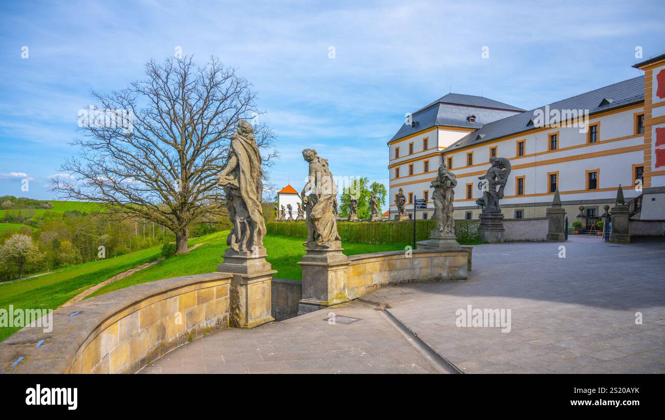 Visitors admire the impressive Baroque statues that adorn the grounds ...