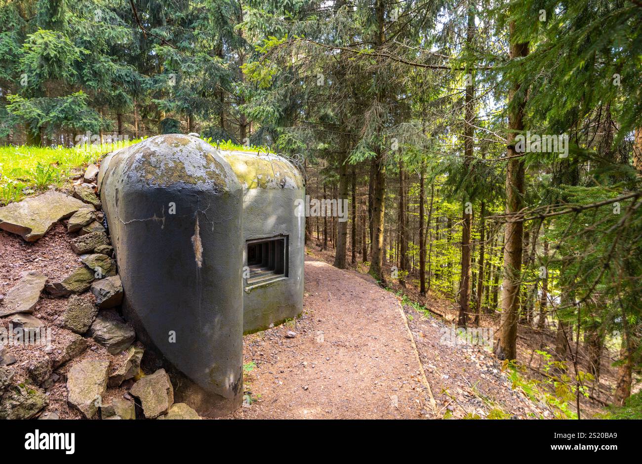 Czechoslovak border fortifications stand amidst lush green forest ...