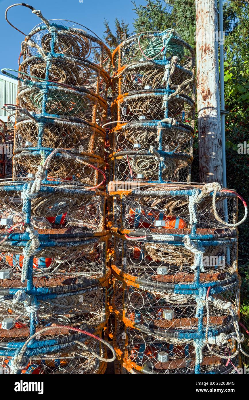 Colorful crab traps are stacked at the marina in Ilwaco Harbor in ...