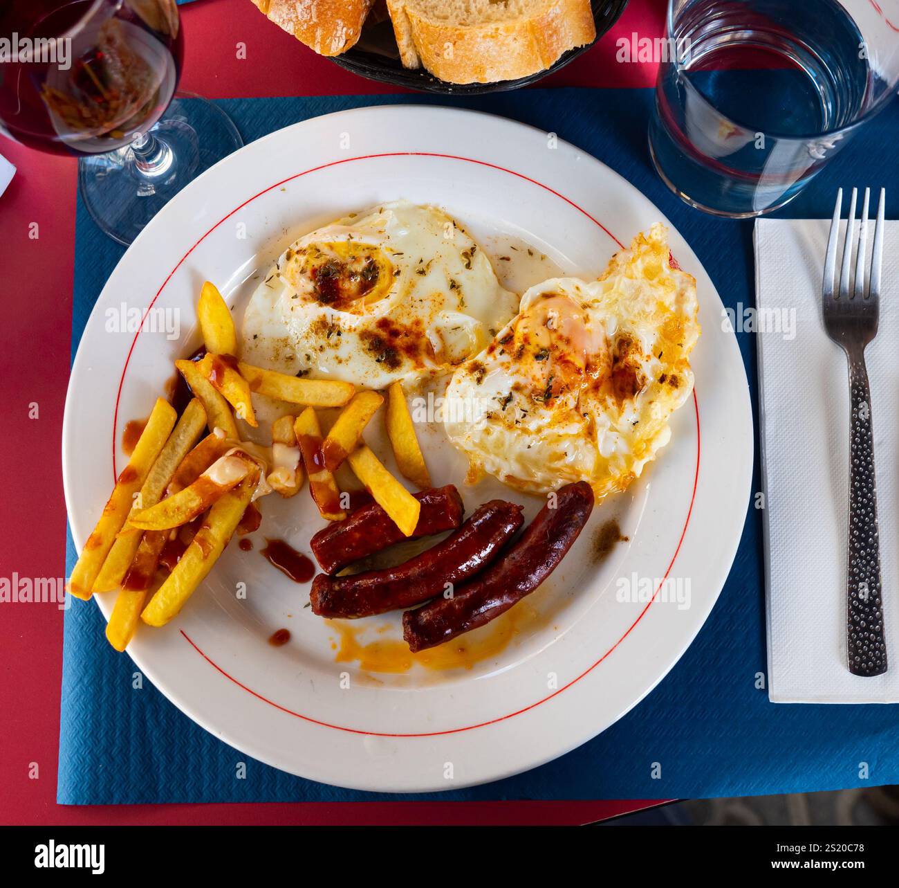 Popular spanish dish is fried eggs with chistorra and potatoes Stock ...