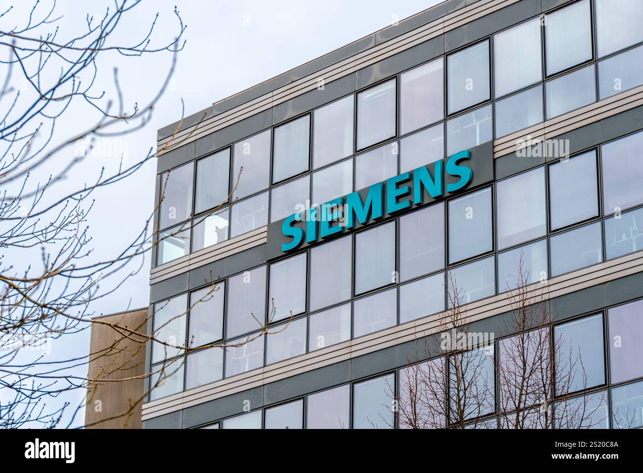 Sign at the top of a Siemens Mobility building. Siemens is a German ...