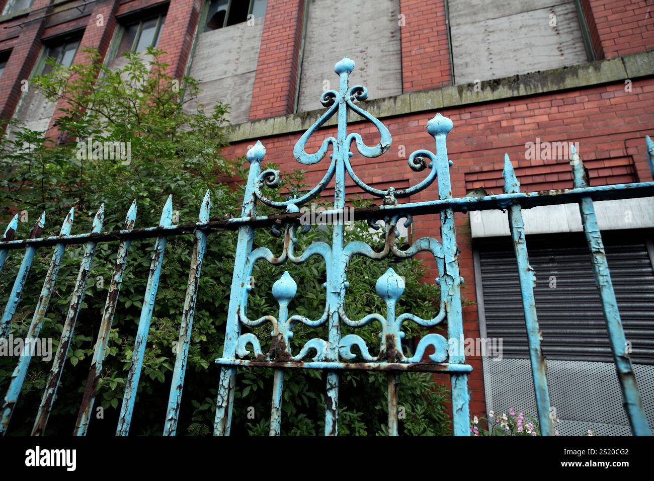 Art Nouveau motifs on rusty railings outside Warwick Mill, Oldham Road ...