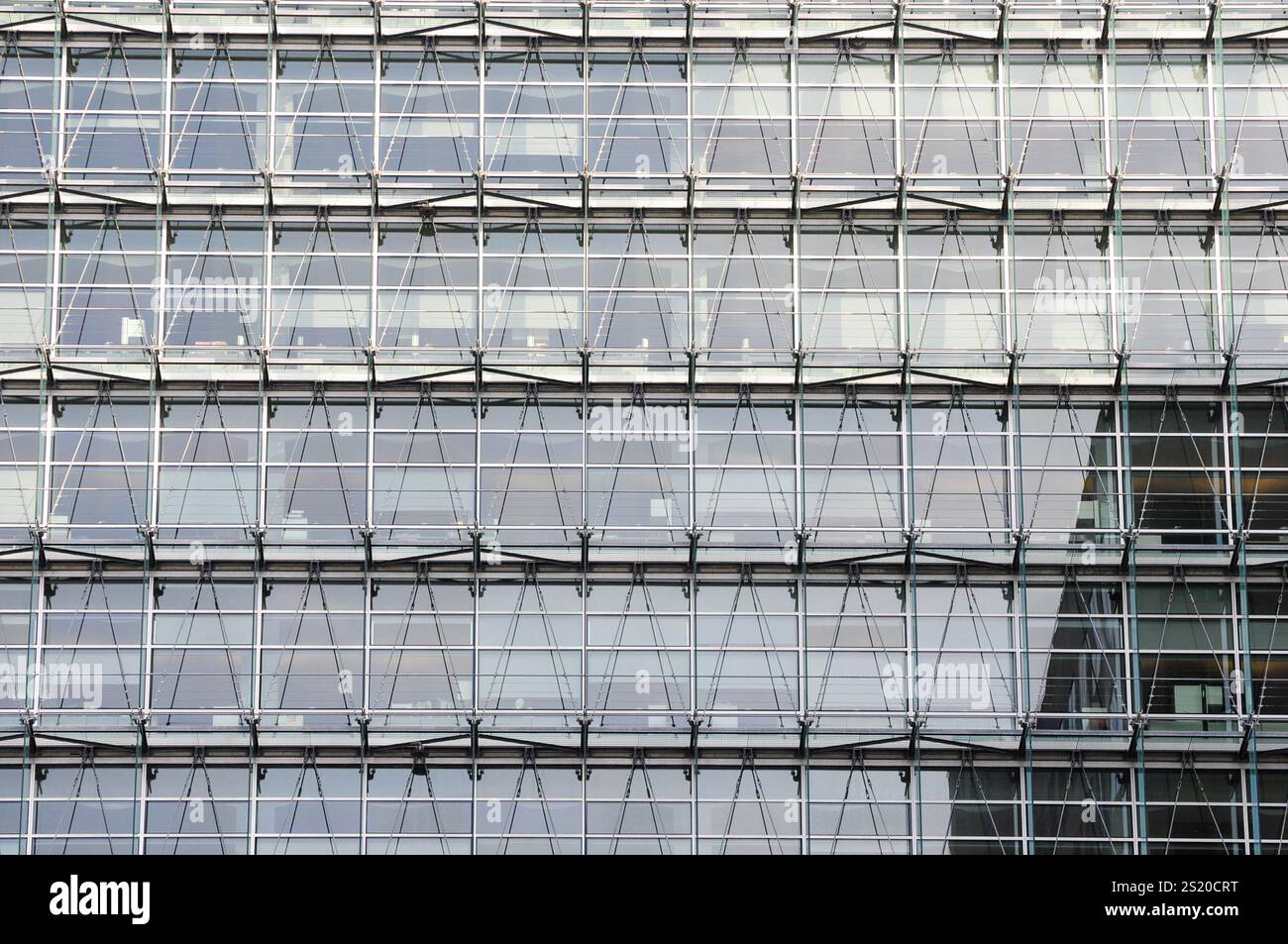 Urban glass facade with intricate architecture in bustling city center ...