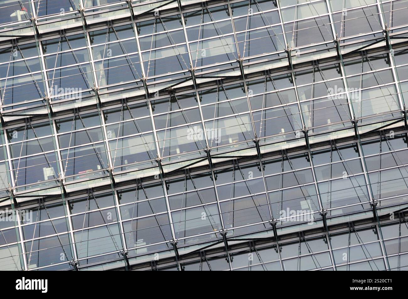 Modern facade with geometric reflective glass windows Stock Photo - Alamy