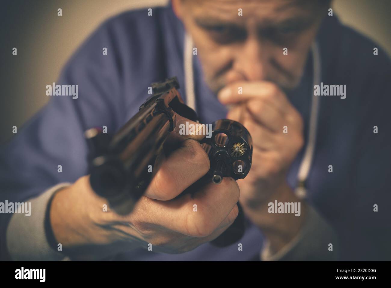 Man take care of six inch revolver caliber .357 magnum at home Stock ...