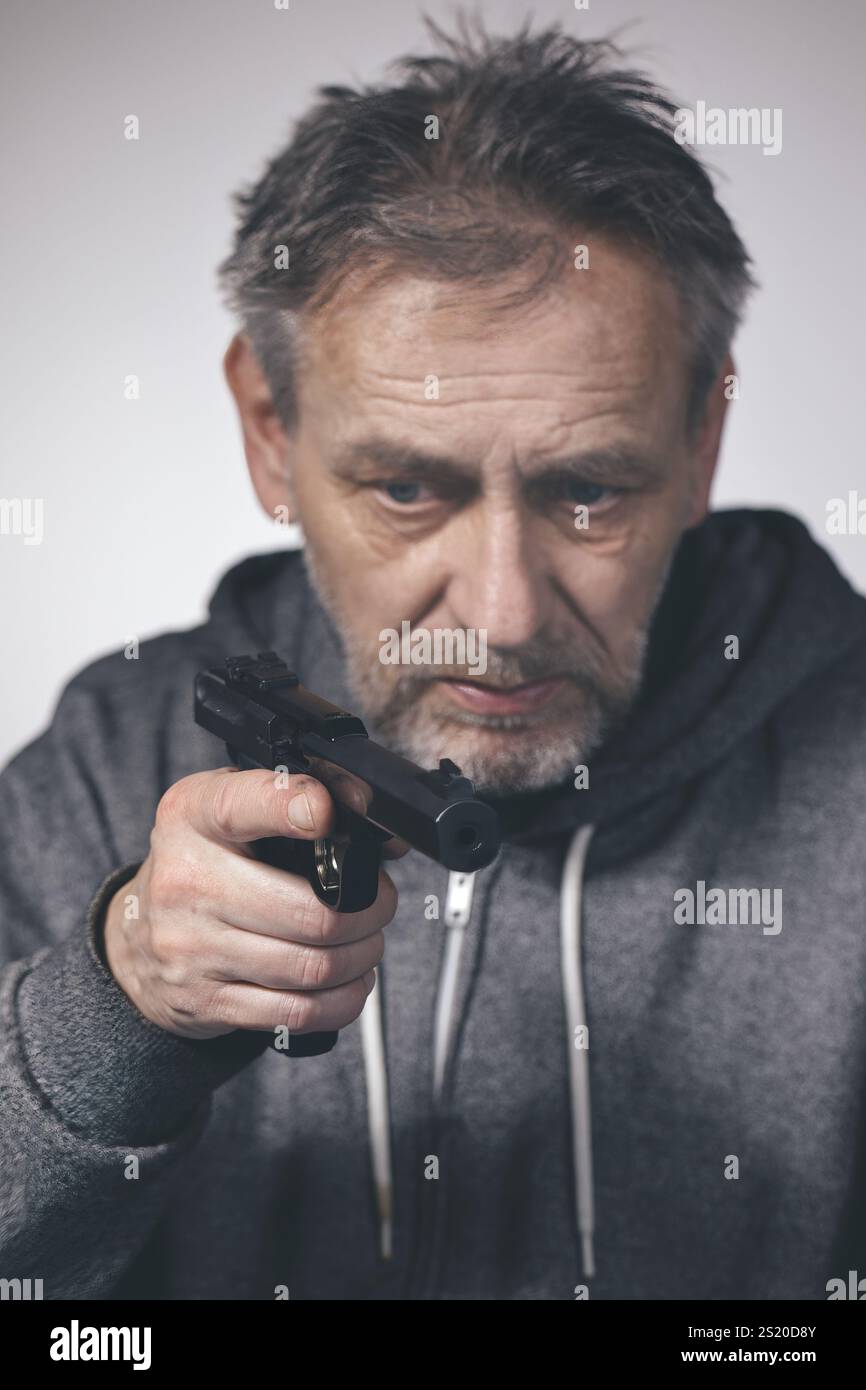 Man take care of small caliber semi automatic sporting gun .22 LR Stock ...