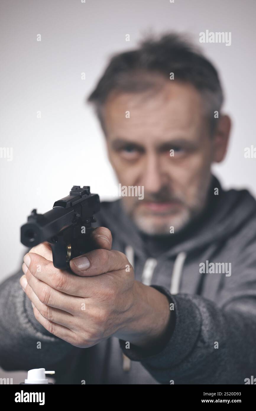 Man take care of small caliber semi automatic sporting gun .22 LR Stock ...