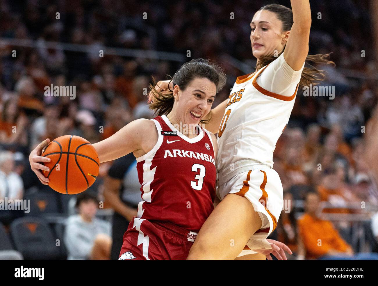 Arkansas guard Izzy Higginbottom (3) is defended by Texas guard Shay ...