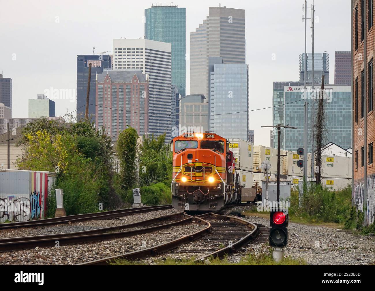 A Progress Rail company intermodal train is leaving Houston downtown ...