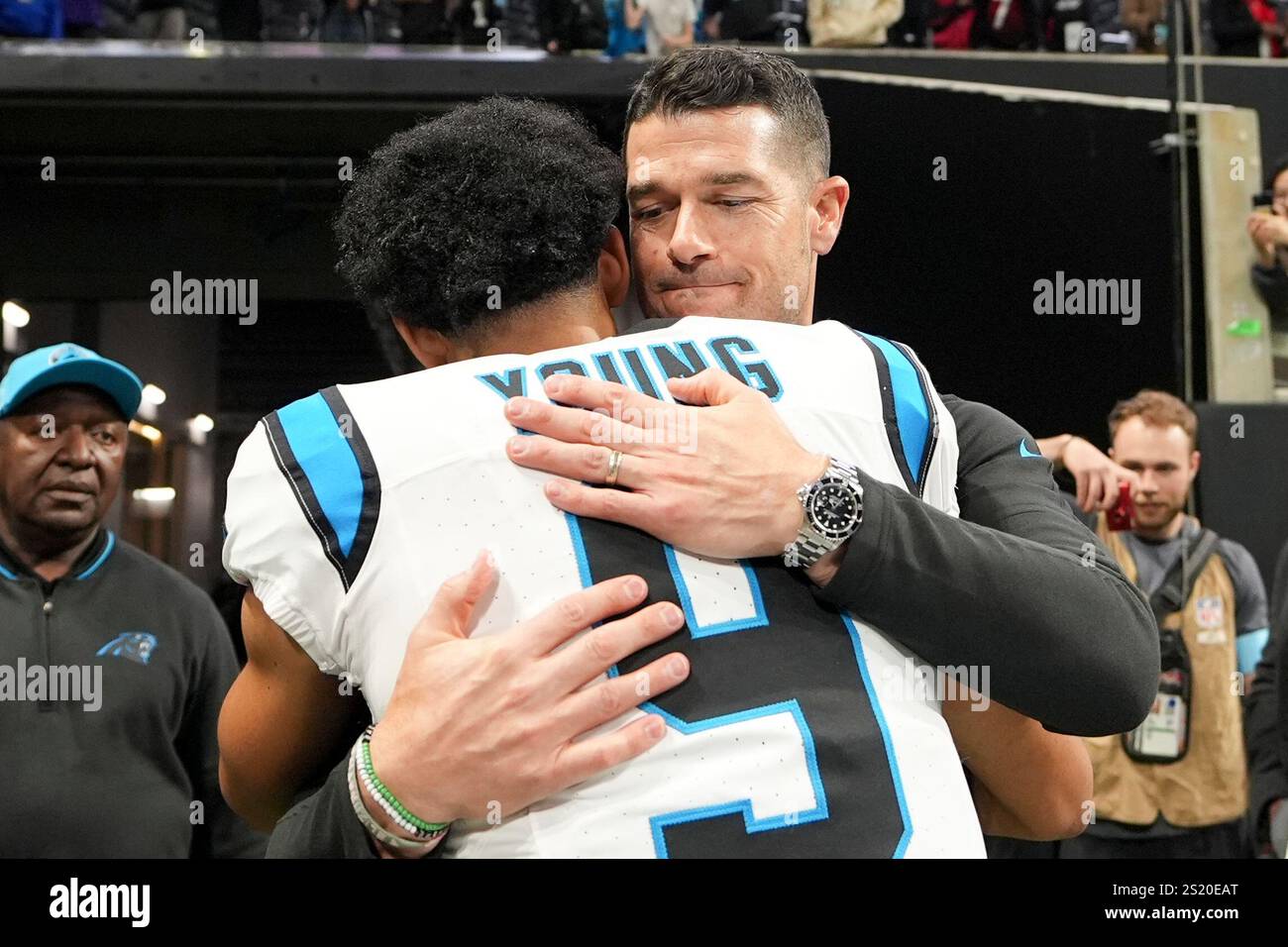 Carolina Panthers quarterback Bryce Young and Carolina Panthers head coach Dave Canales hug ...