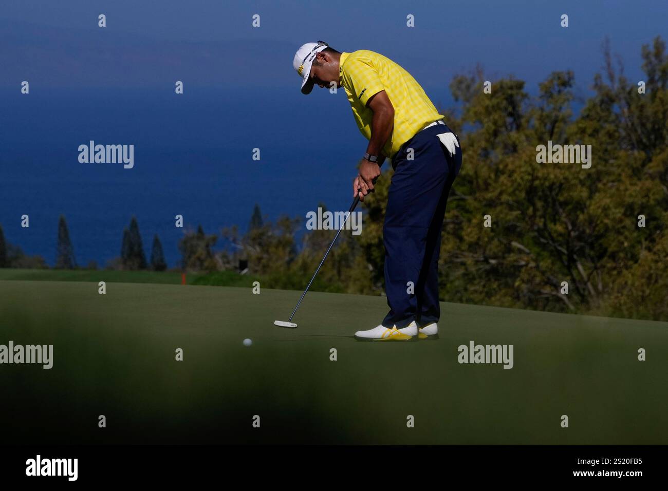 Hideki Matsuyama, of Japan, putts on the fourth green during the final ...