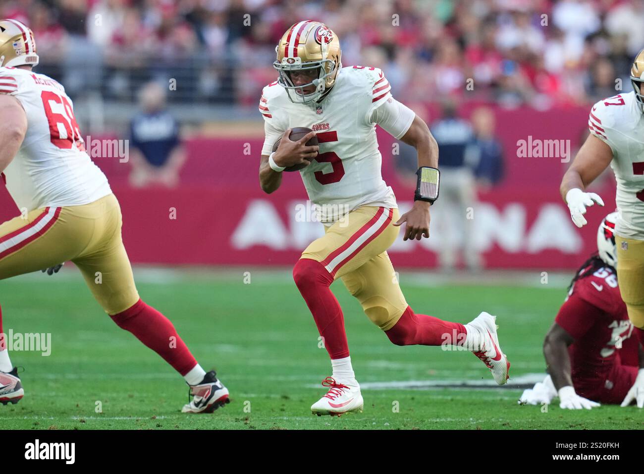 San Francisco 49ers quarterback Joshua Dobbs (5) runs against the ...