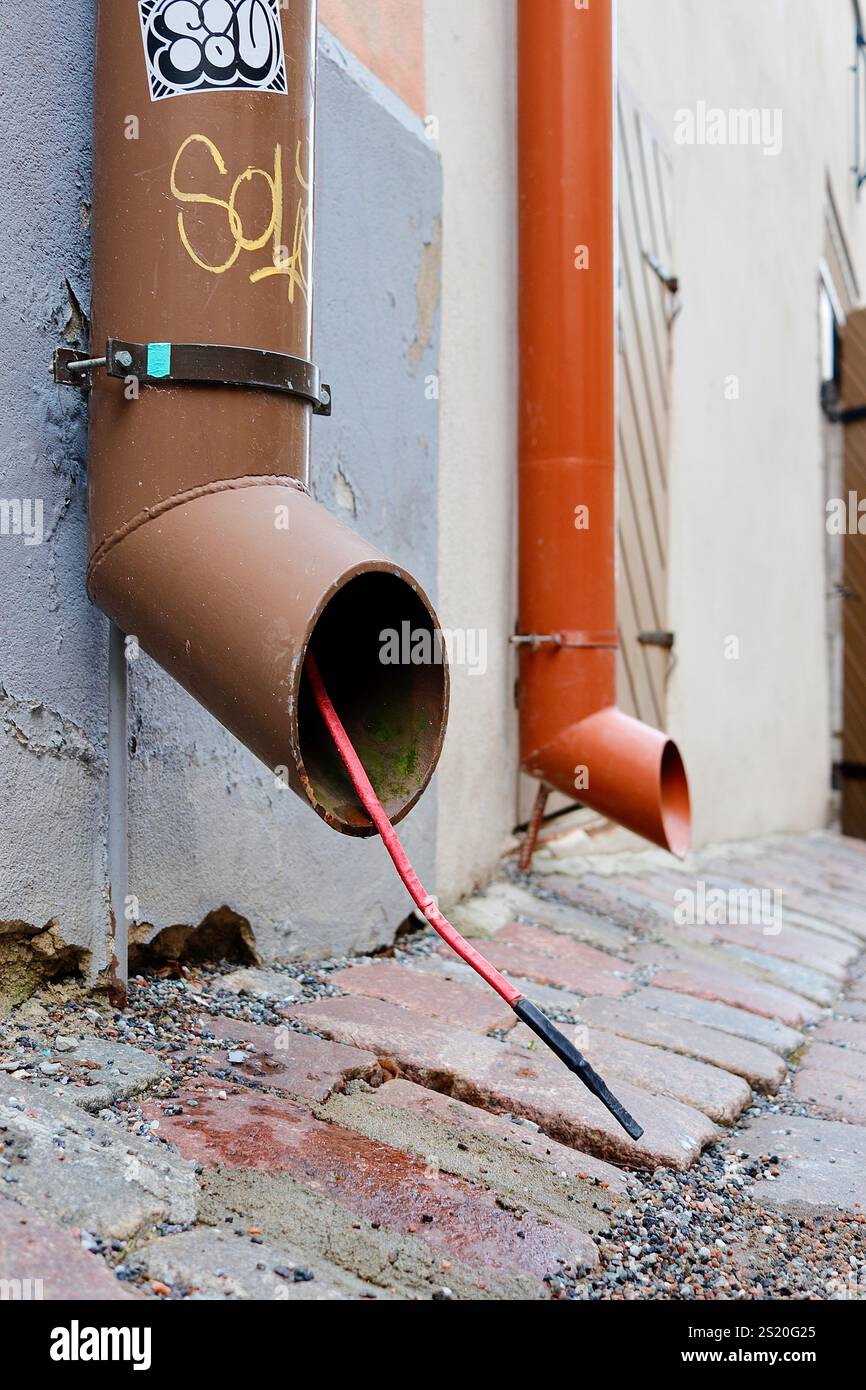Heated electrical cables are run through drainpipes to melt ice and ...