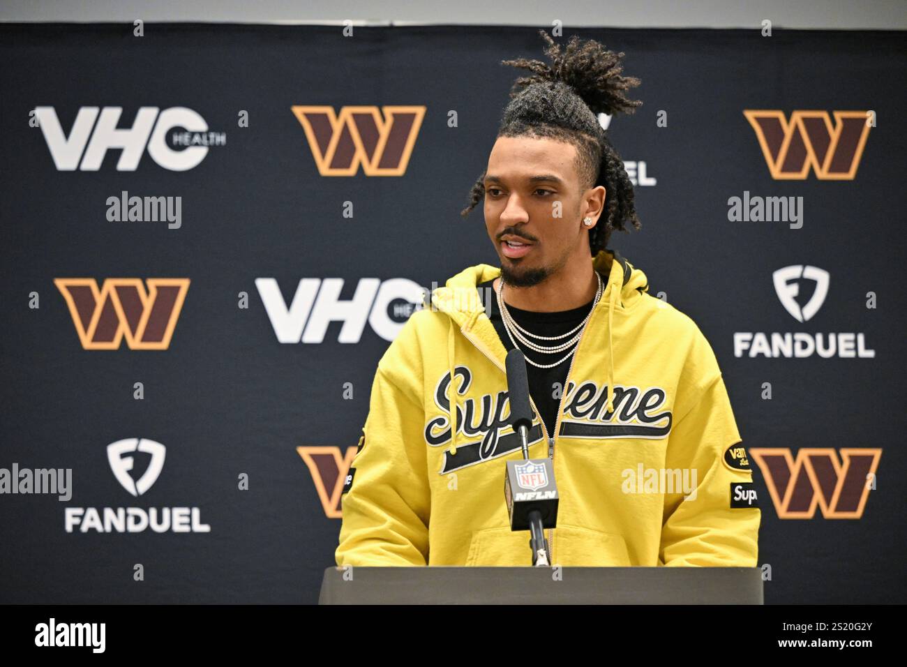 Washington Commanders quarterback Jayden Daniels talks to reporters ...