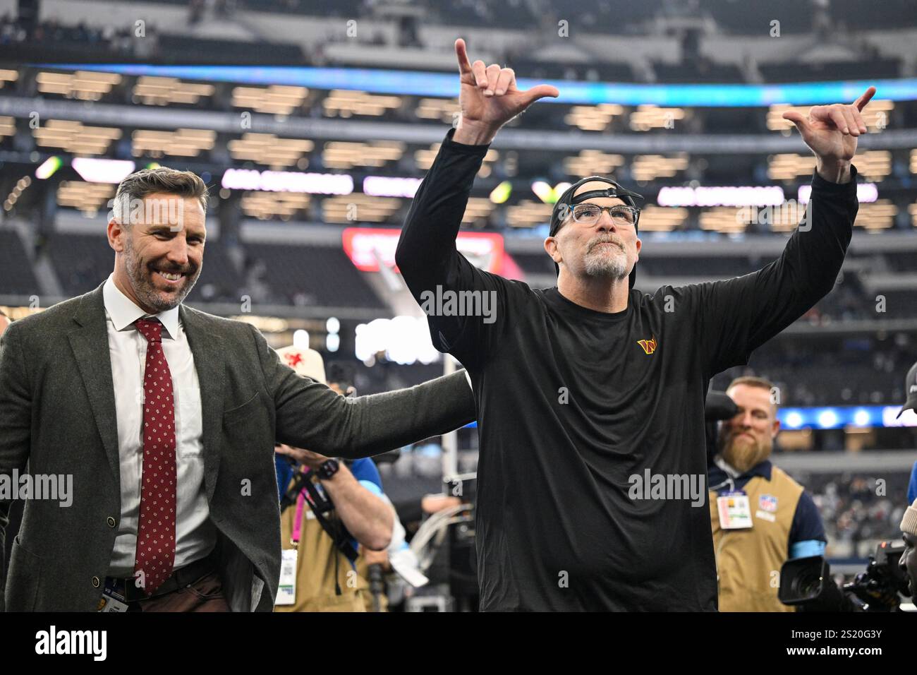 Washington Commanders head coach Dan Quinn, right, gestures while ...