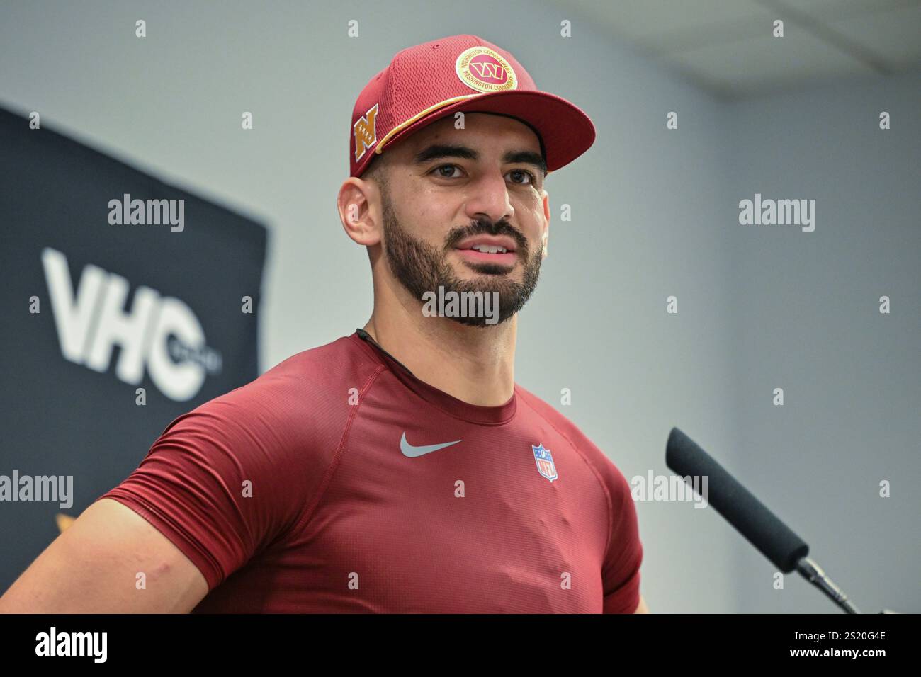 Washington Commanders quarterback Marcus Mariota talks to reporters ...