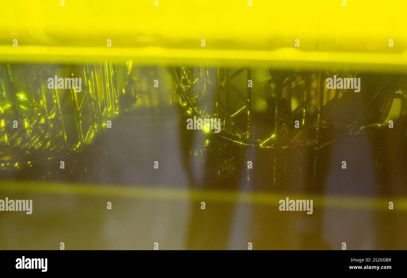 Process working 3D printer. 3D printing from liquid material close-up ...