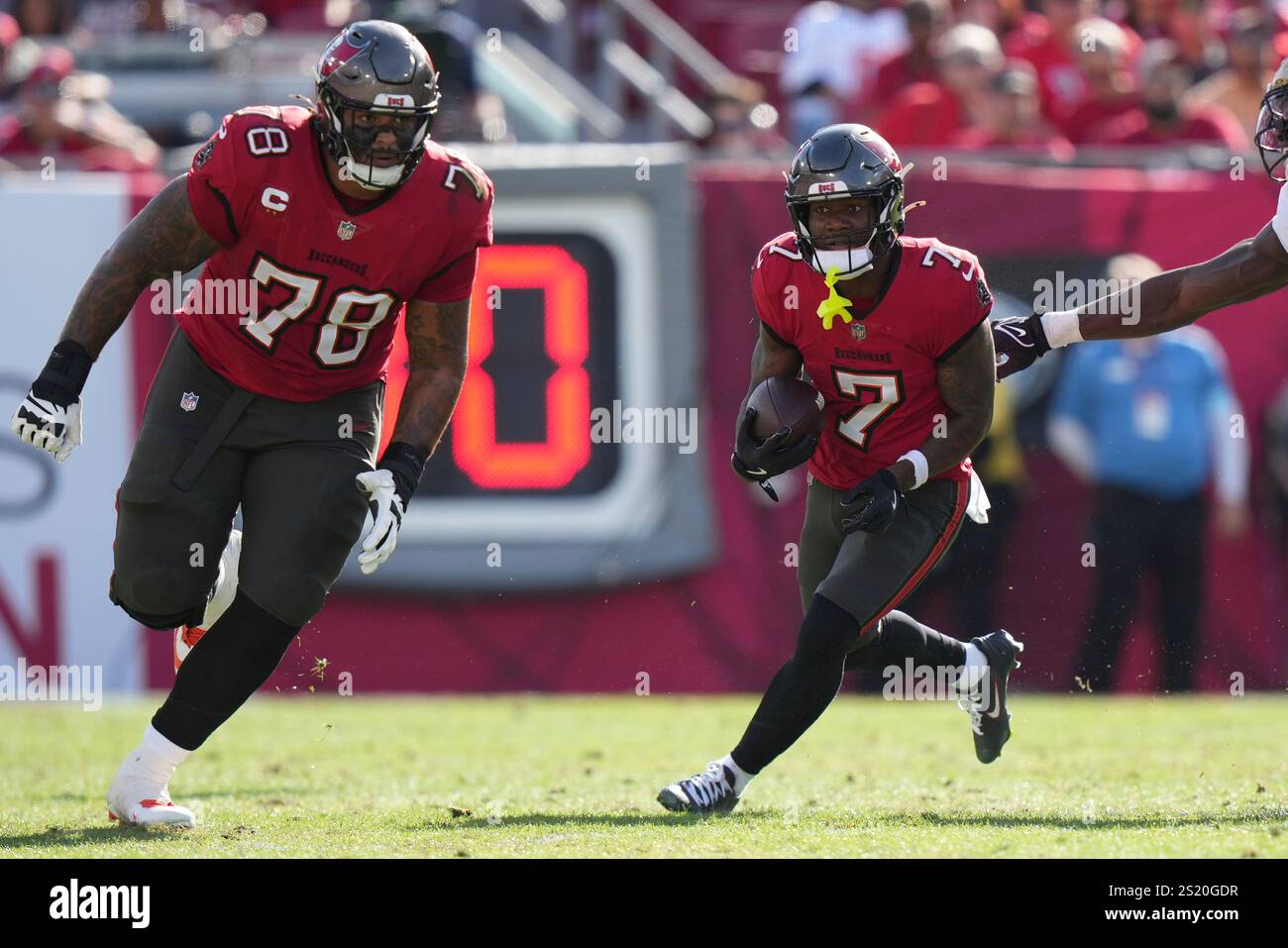 Tampa Bay Buccaneers running back Bucky Irving (7) rushes with the ball ...