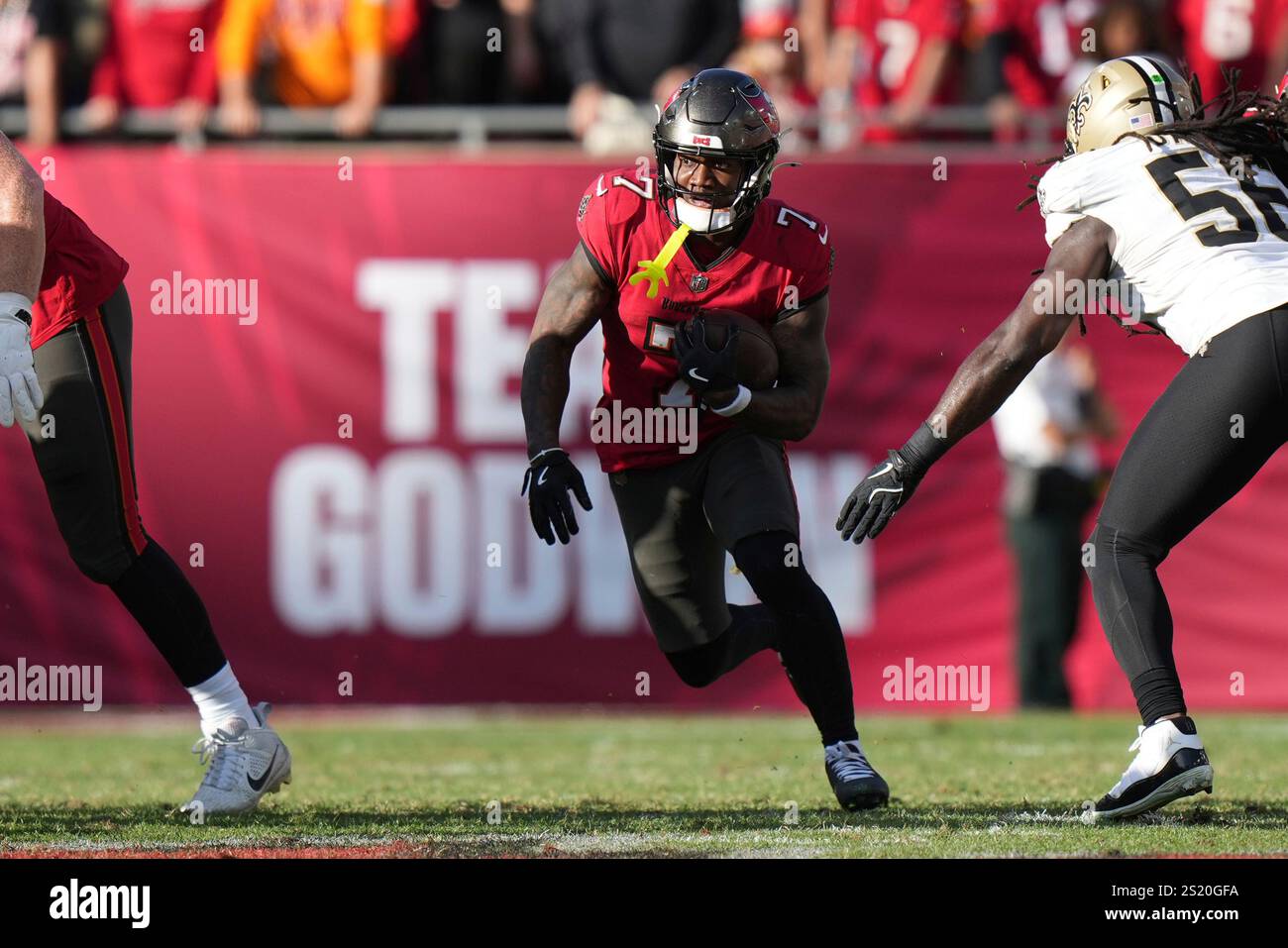 Tampa Bay Buccaneers running back Bucky Irving (7) rushes with the ball ...