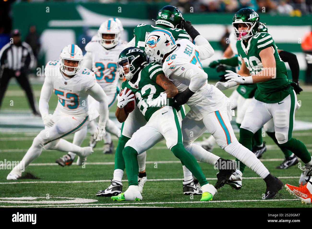 Miami Dolphins linebacker Quinton Bell (56) tackles New York Jets ...