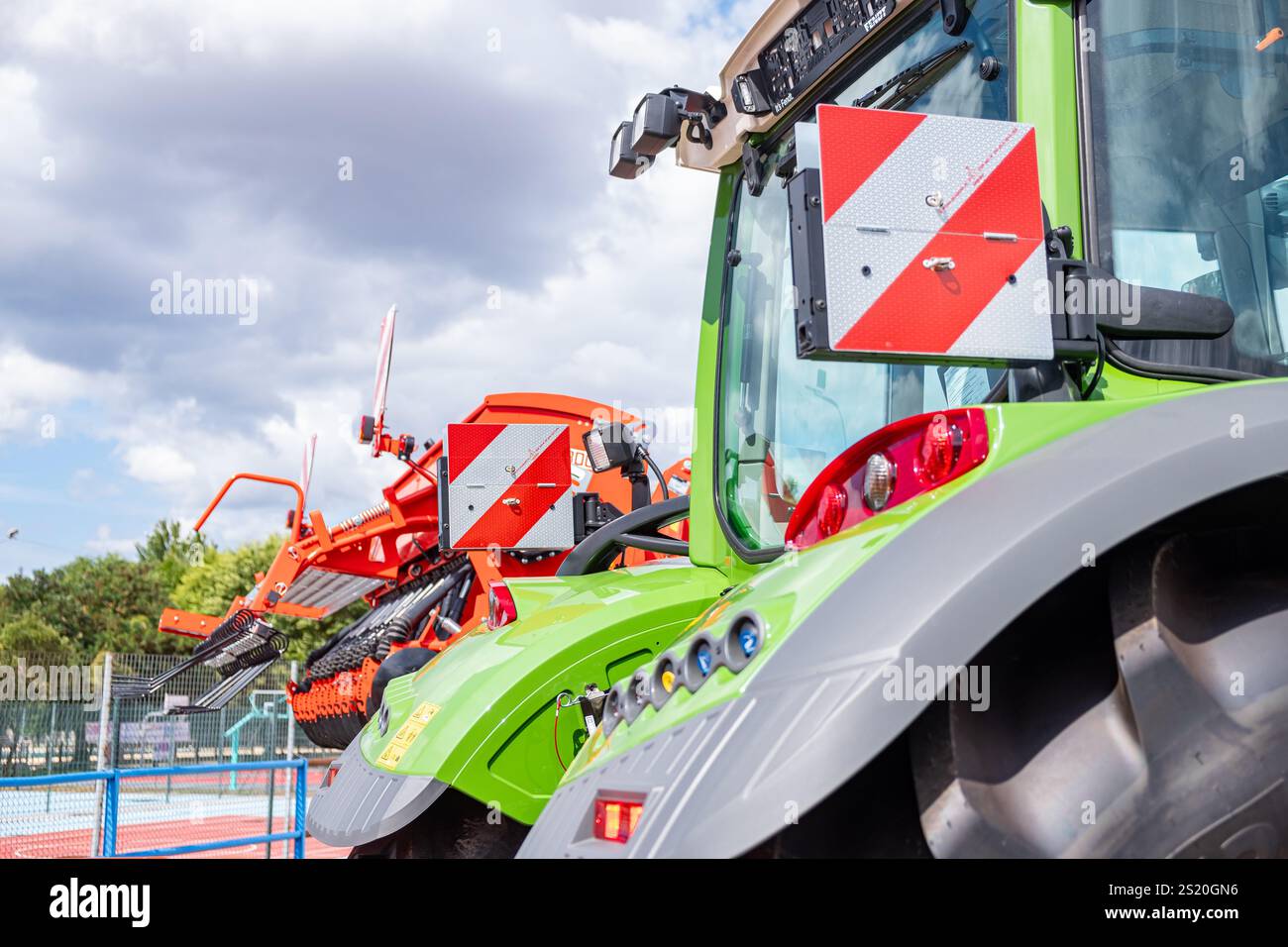 view of the rear of two tractors on display for sale at an agricultural ...