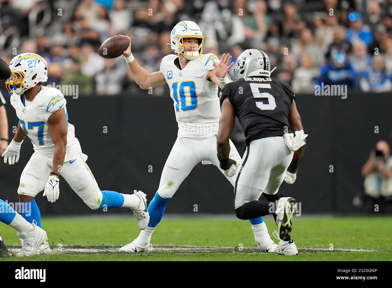 Los Angeles Chargers quarterback Justin Herbert (10) passes as Las ...