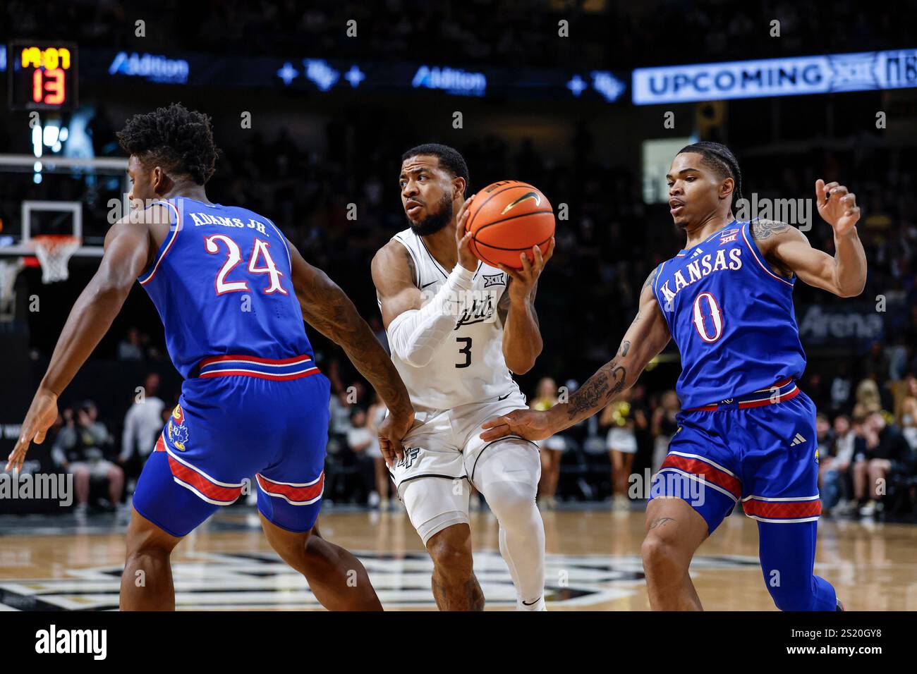 Central Florida guard Darius Johnson (3) is defended by Kansas forward ...