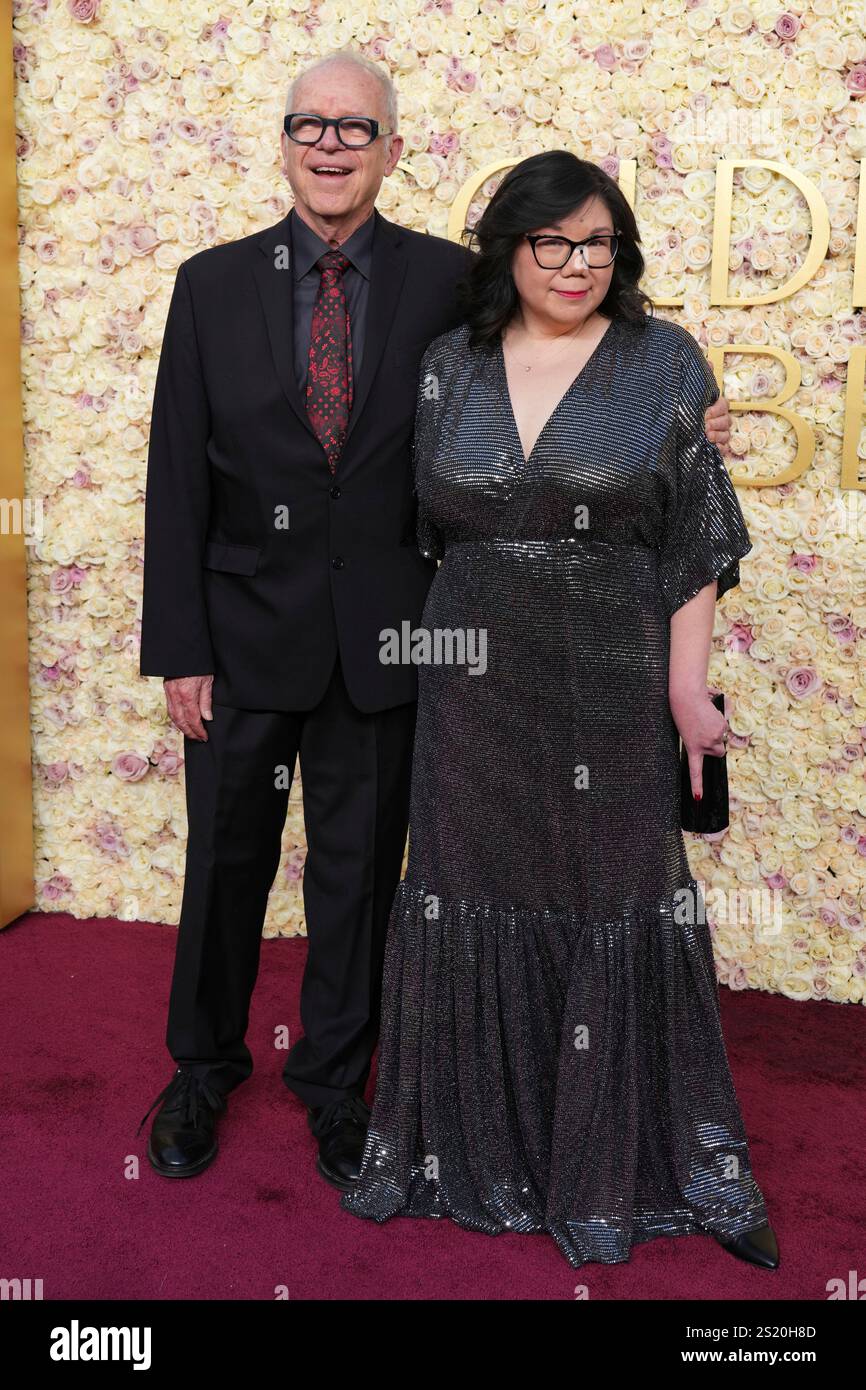 Tim Gray, left, and Judy Lung arrive at the 82nd Golden Globes on ...