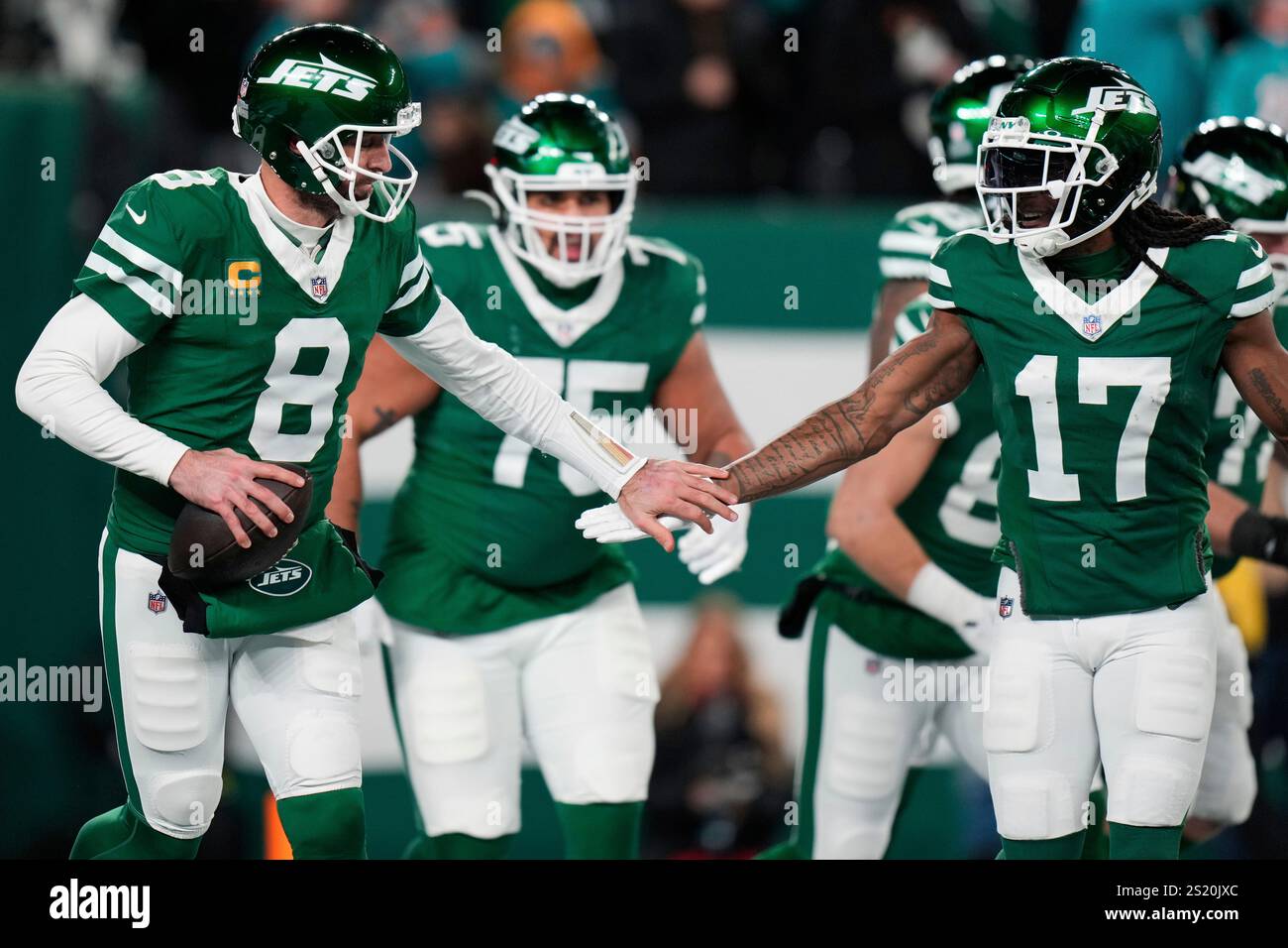 New York Jets quarterback Aaron Rodgers (8) celebrates with wide ...