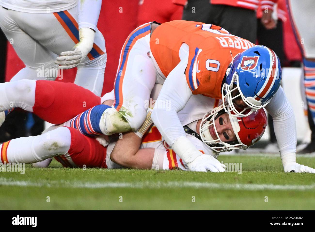 Kansas City Chiefs quarterback Carson Wentz, bottom, is sacked by ...