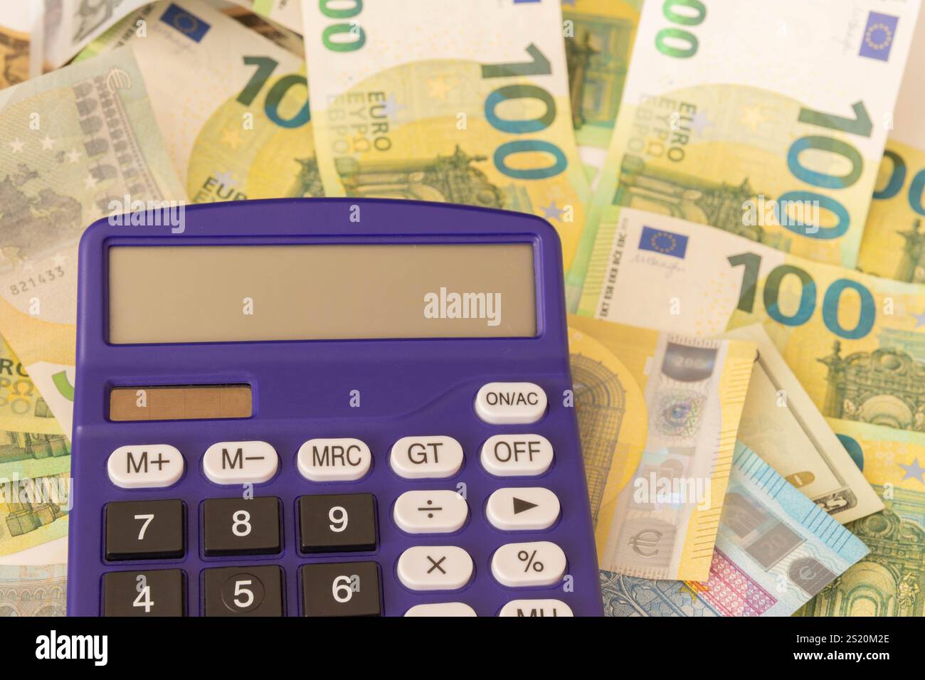 Blue digital calculator on a white background. Top view with place to ...