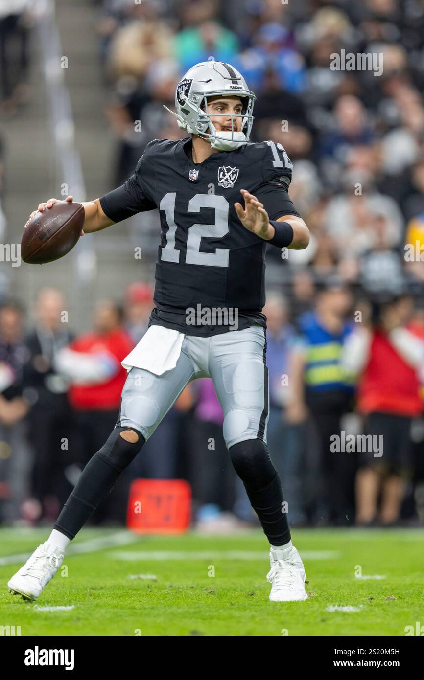 Las Vegas Raiders quarterback Aidan O'Connell (12) drops back to pass ...