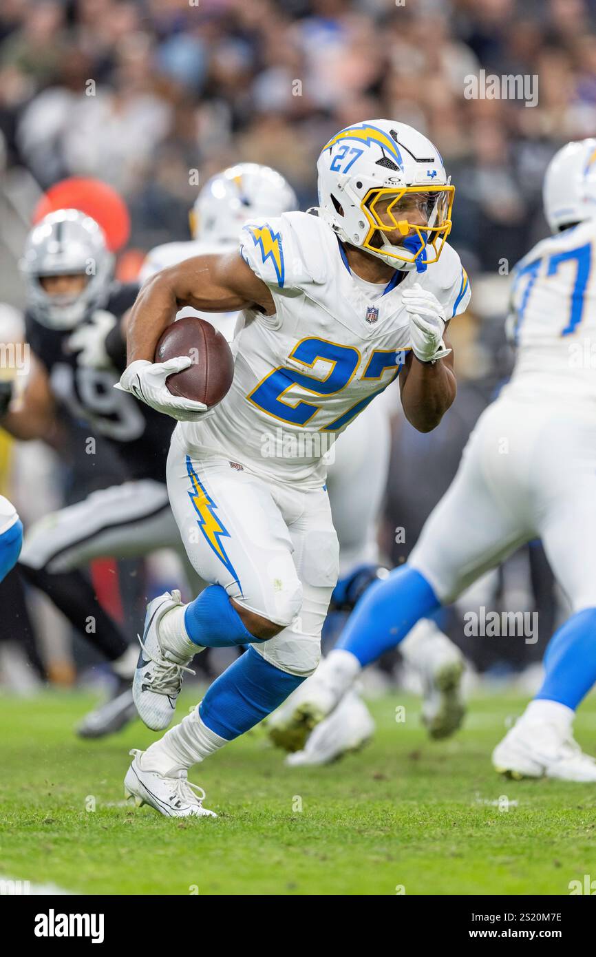 Los Angeles Chargers running back J.K. Dobbins (27) runs the ball ...