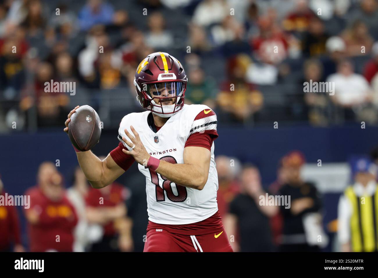 Washington Commanders quarterback Marcus Mariota (18) looks to pass ...