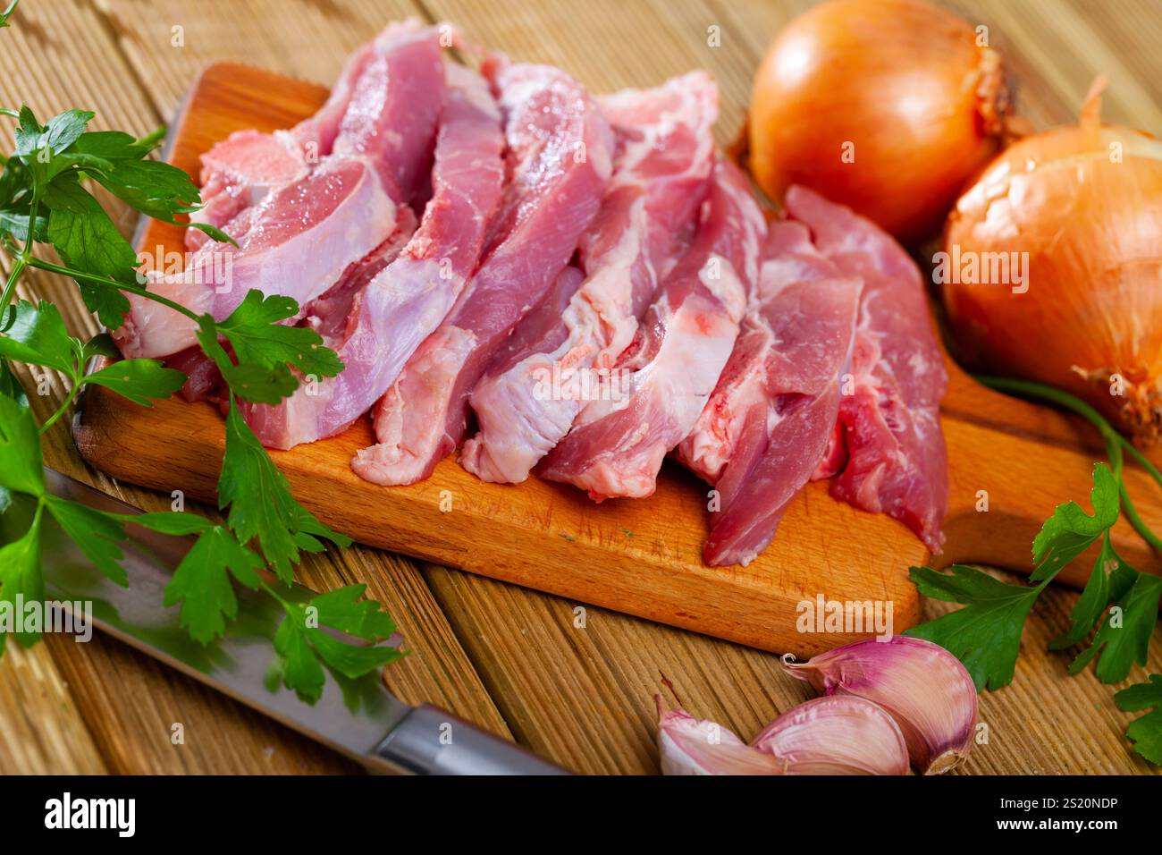 Raw sliced turkey thigh Stock Photo - Alamy
