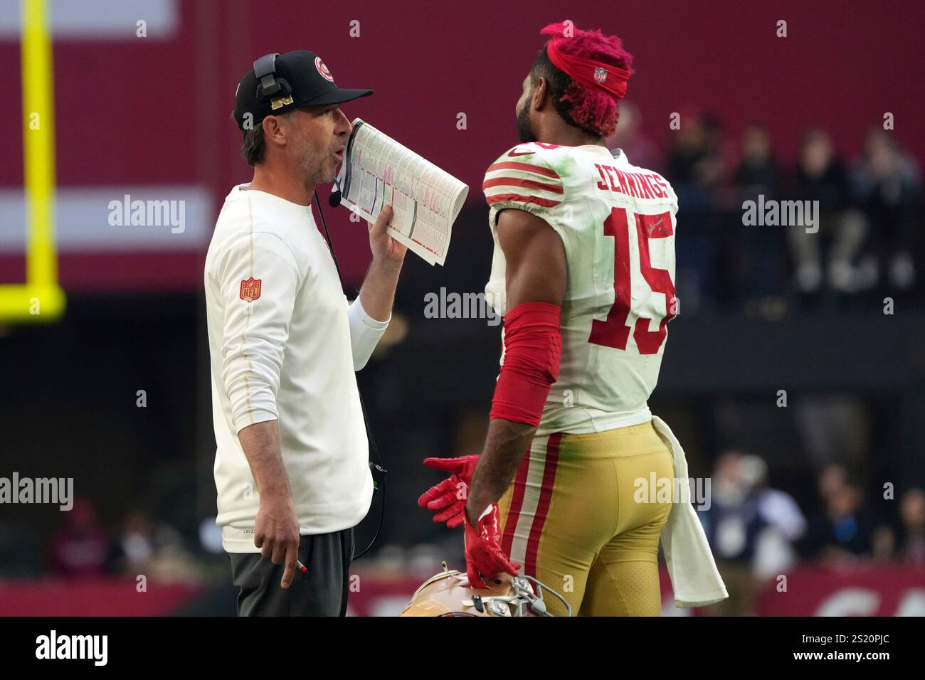 San Francisco 49ers head coach Kyle Shanahan, left, talks with wide ...