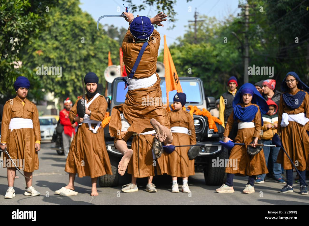 NOIDA, INDIA - JANUARY 5: Sikh devotees display Gatka martial art skills during a 'Nagar Kirtan ...