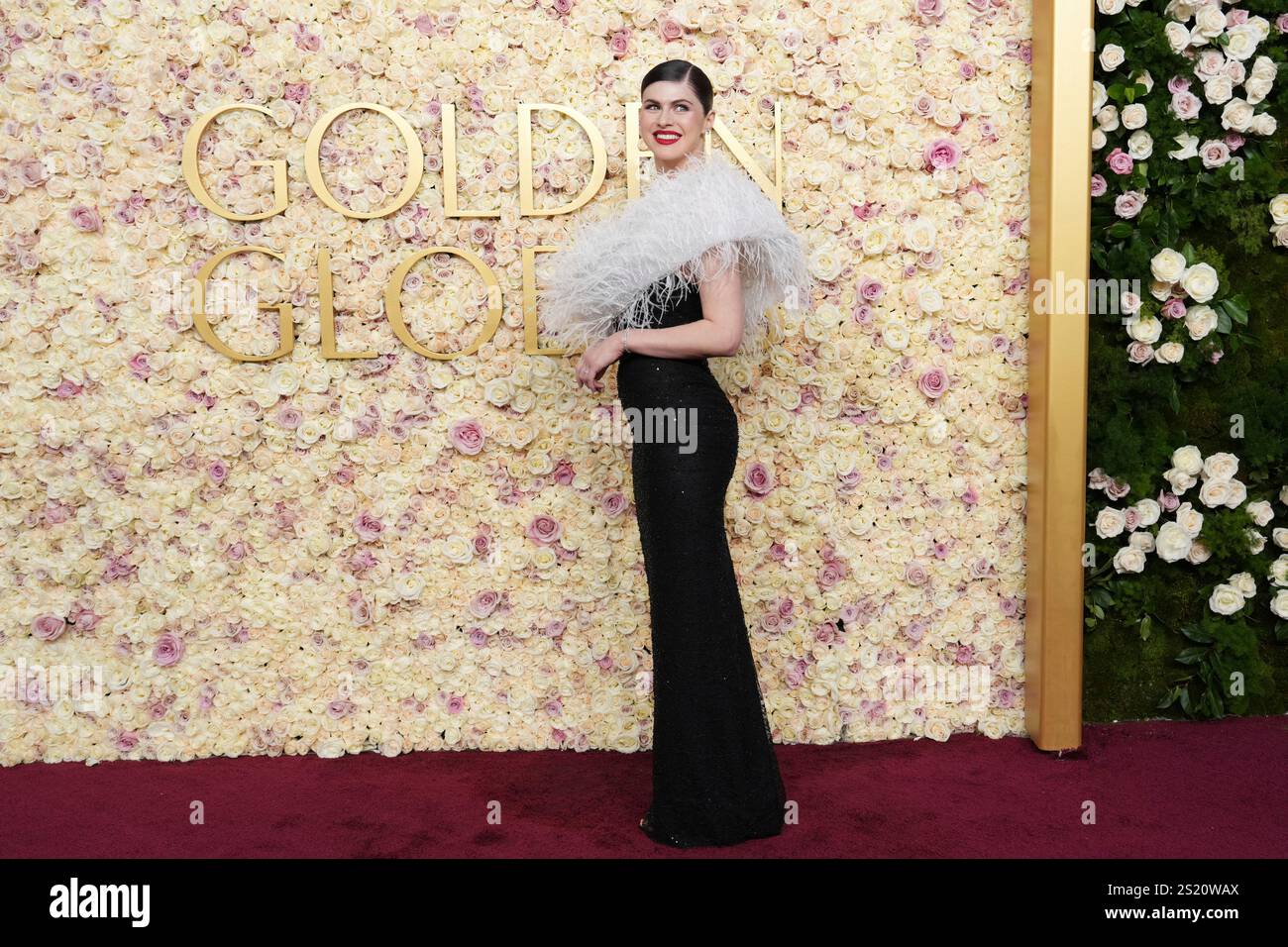 Alexandra Daddario arrives at the 82nd Golden Globes on Sunday, Jan. 5 ...