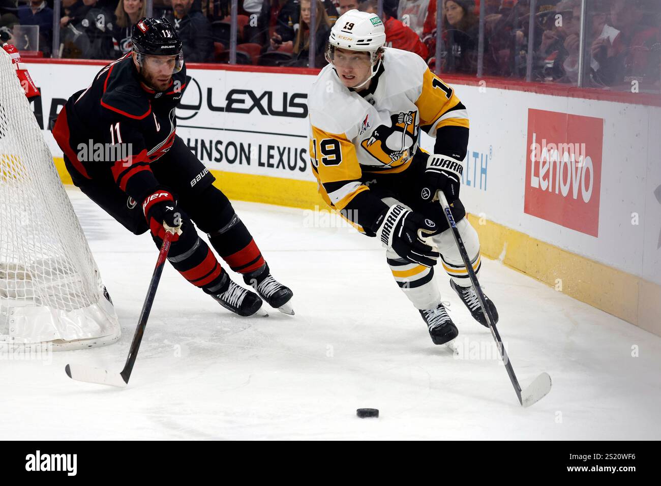 Pittsburgh Penguins' Cody Glass (19) protects the puck from Carolina ...