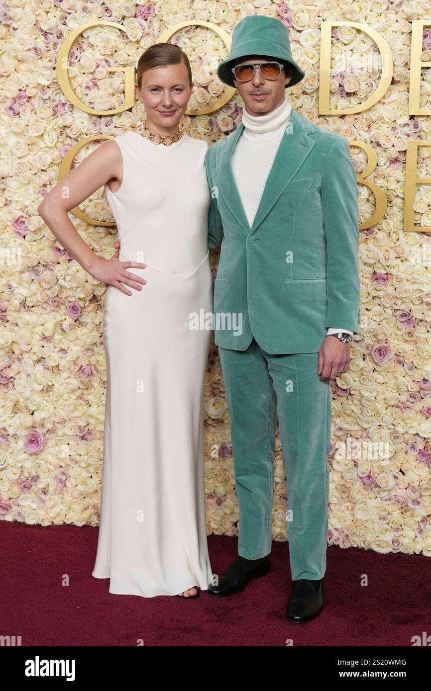 Emma Wall, left, and Jeremy Strong arrive at the 82nd Golden Globes on ...