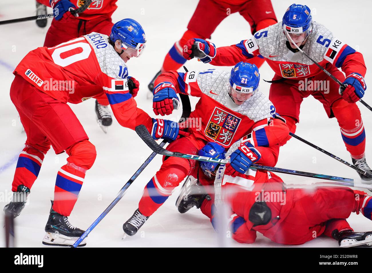 Czechia forward Eduard Sale (12) gets piled on by teammates as they win ...