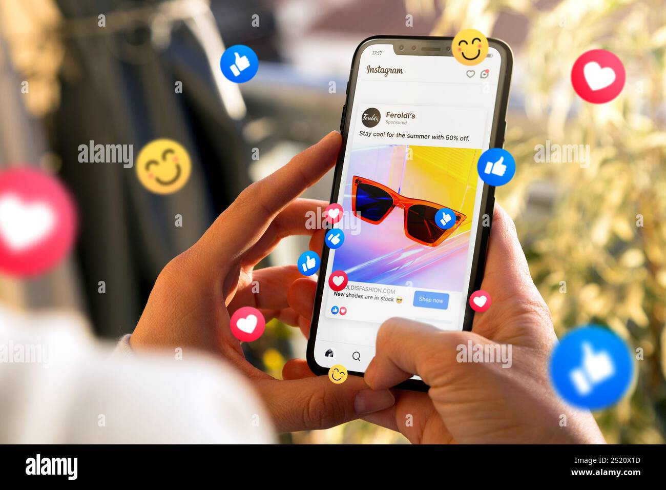 Meta ads on mobile phone screen. Woman holding smartphone showing ...