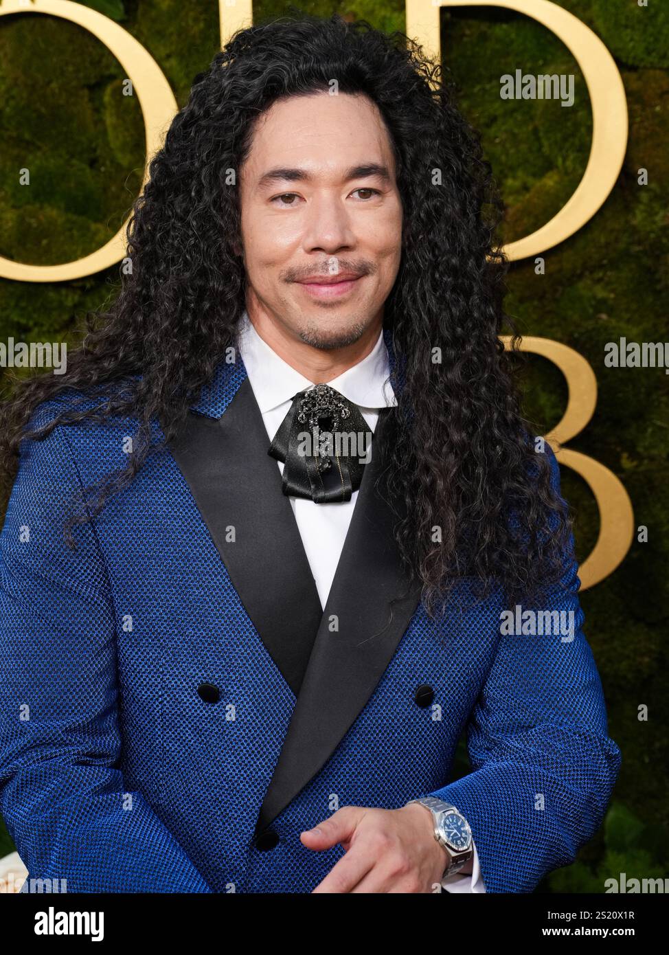Cole Walliser walking on the red carpet at The 82nd Annual Golden Globe ...