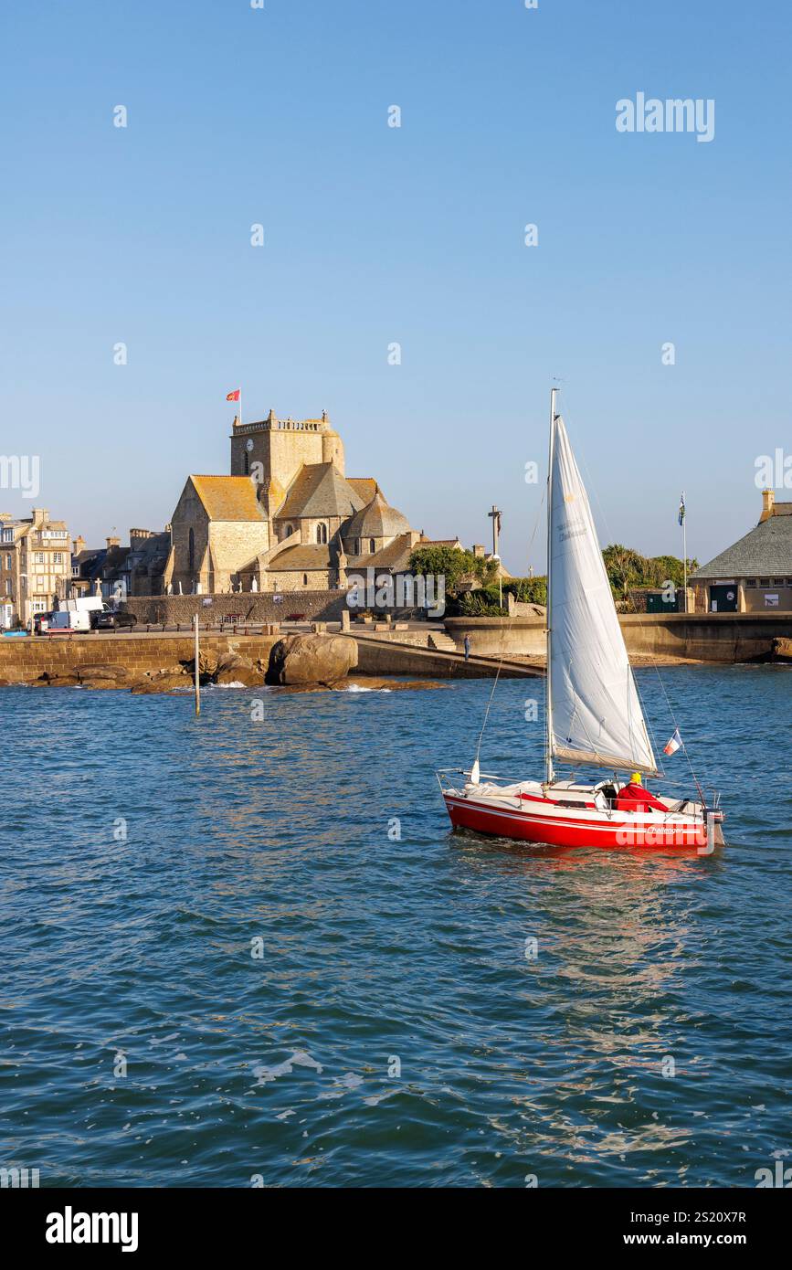 Yacht in harbour in front of church, Barfleur, Manche, Normandy, France ...