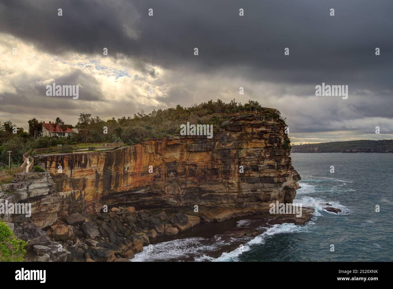 Stormy skies over The Gap, an ocean cliff at the entrance to Sydney ...