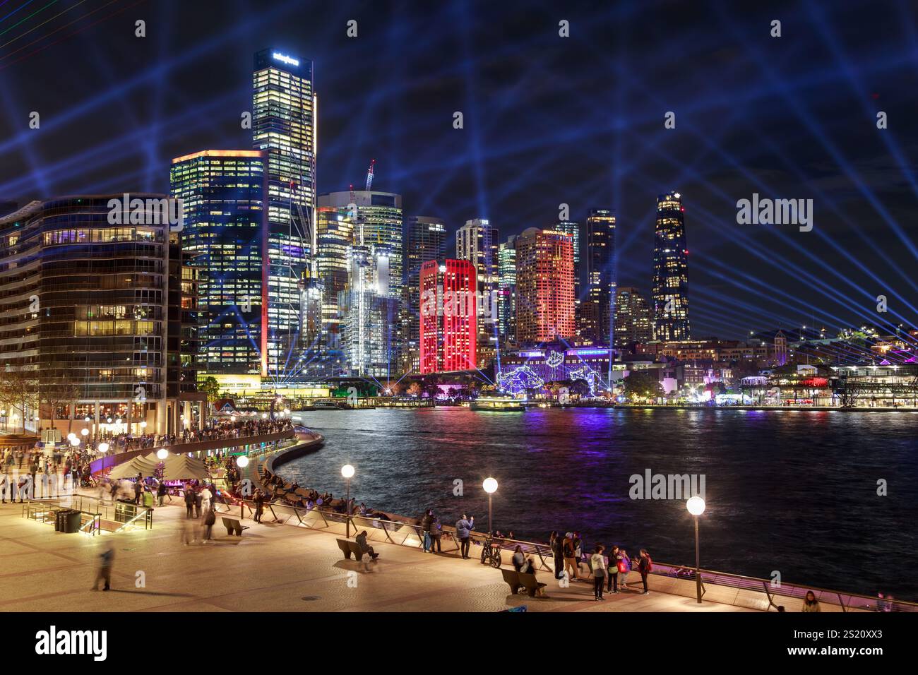 The skyline and waterfront of Sydney, Australia, illuminated with ...
