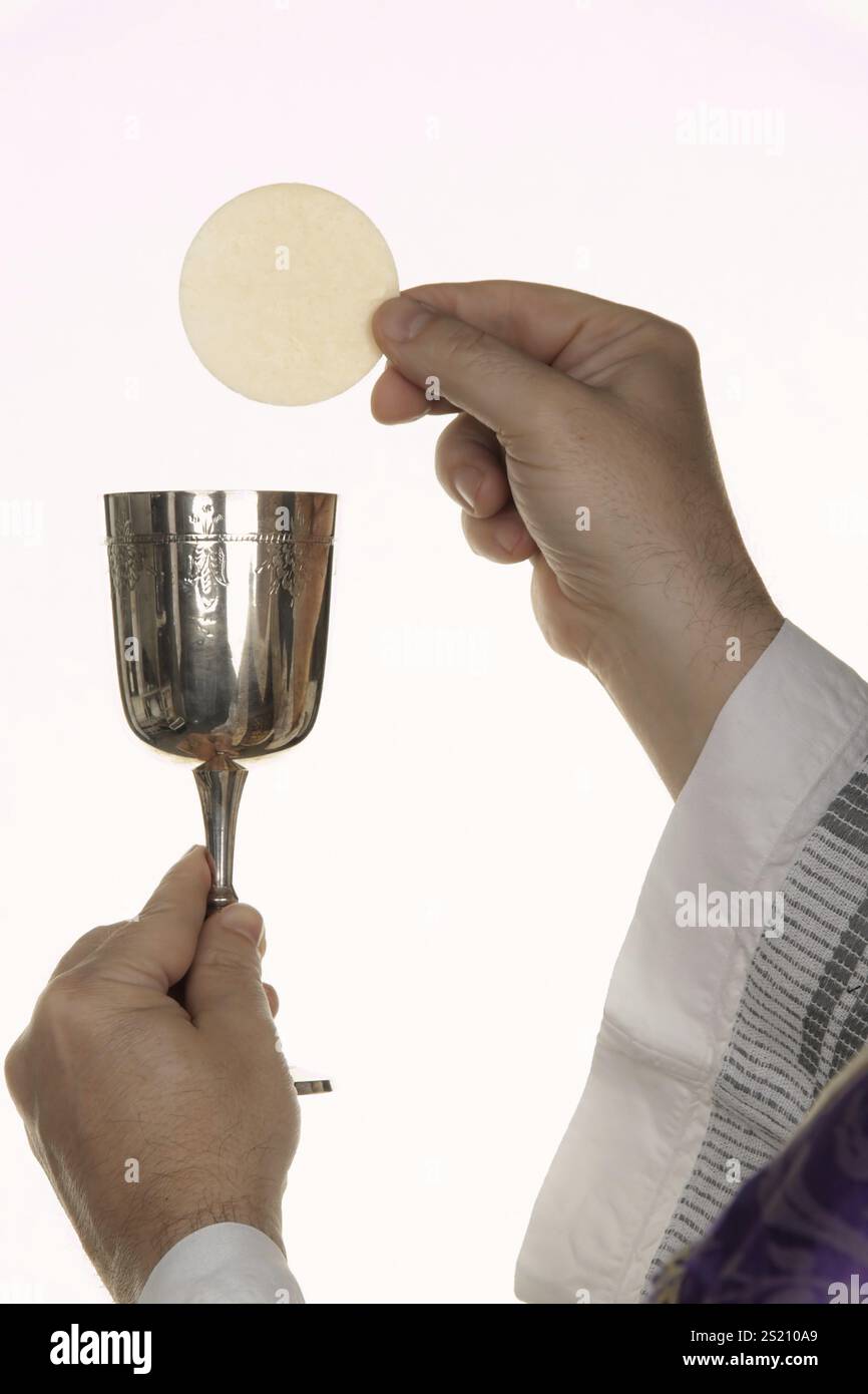 A Catholic priest giving communion at a church service Austria Stock ...